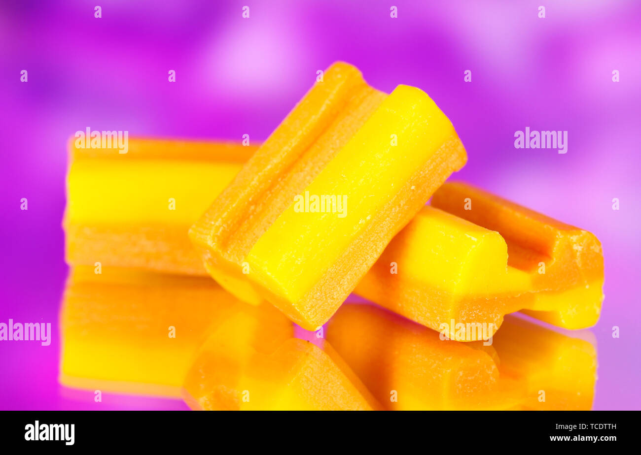 tasty bubble gum on purple background Stock Photo - Alamy