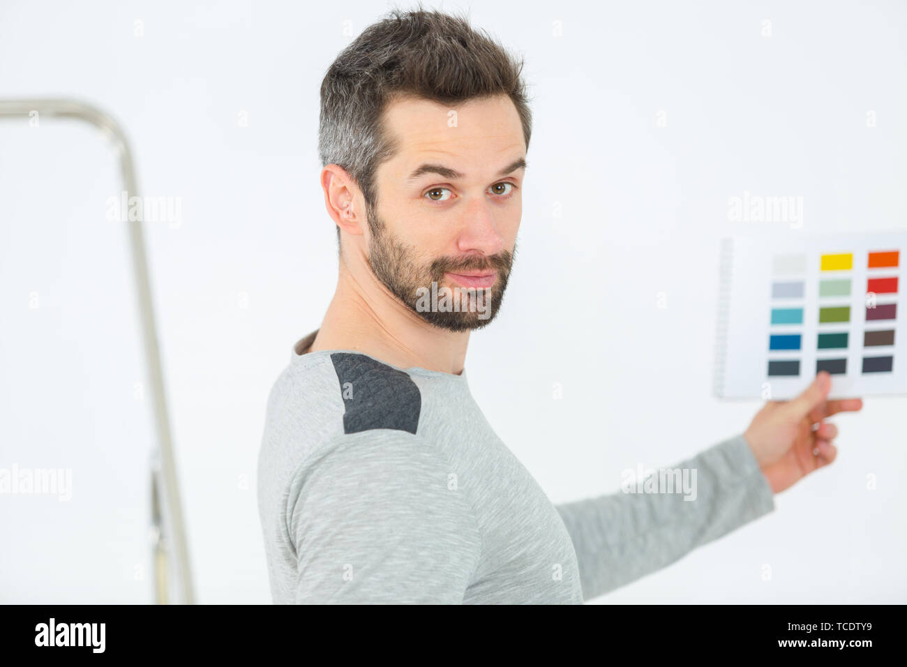 man holding a color palette Stock Photo - Alamy