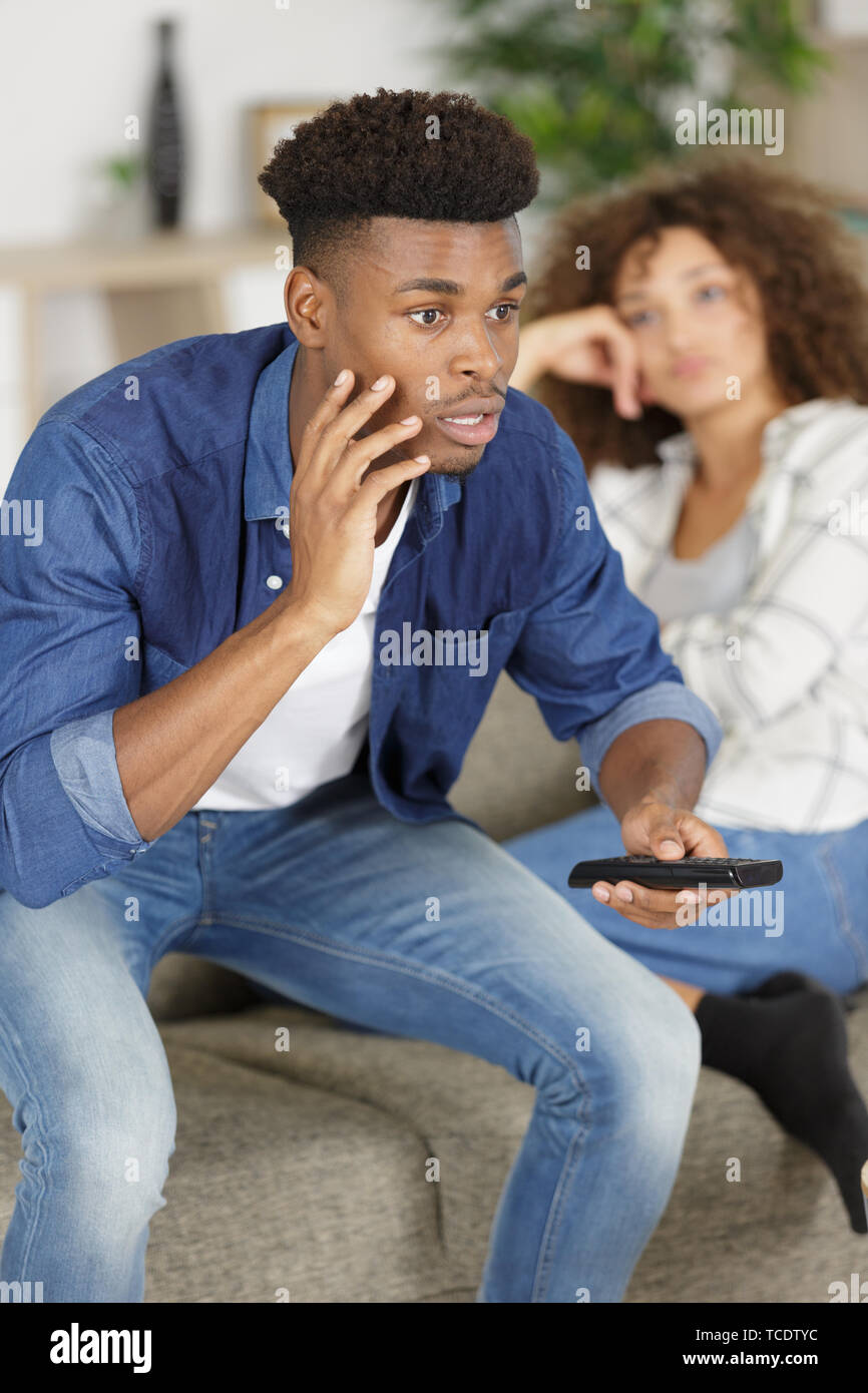 Upset woman husband watching tv hi-res stock photography and images - Alamy