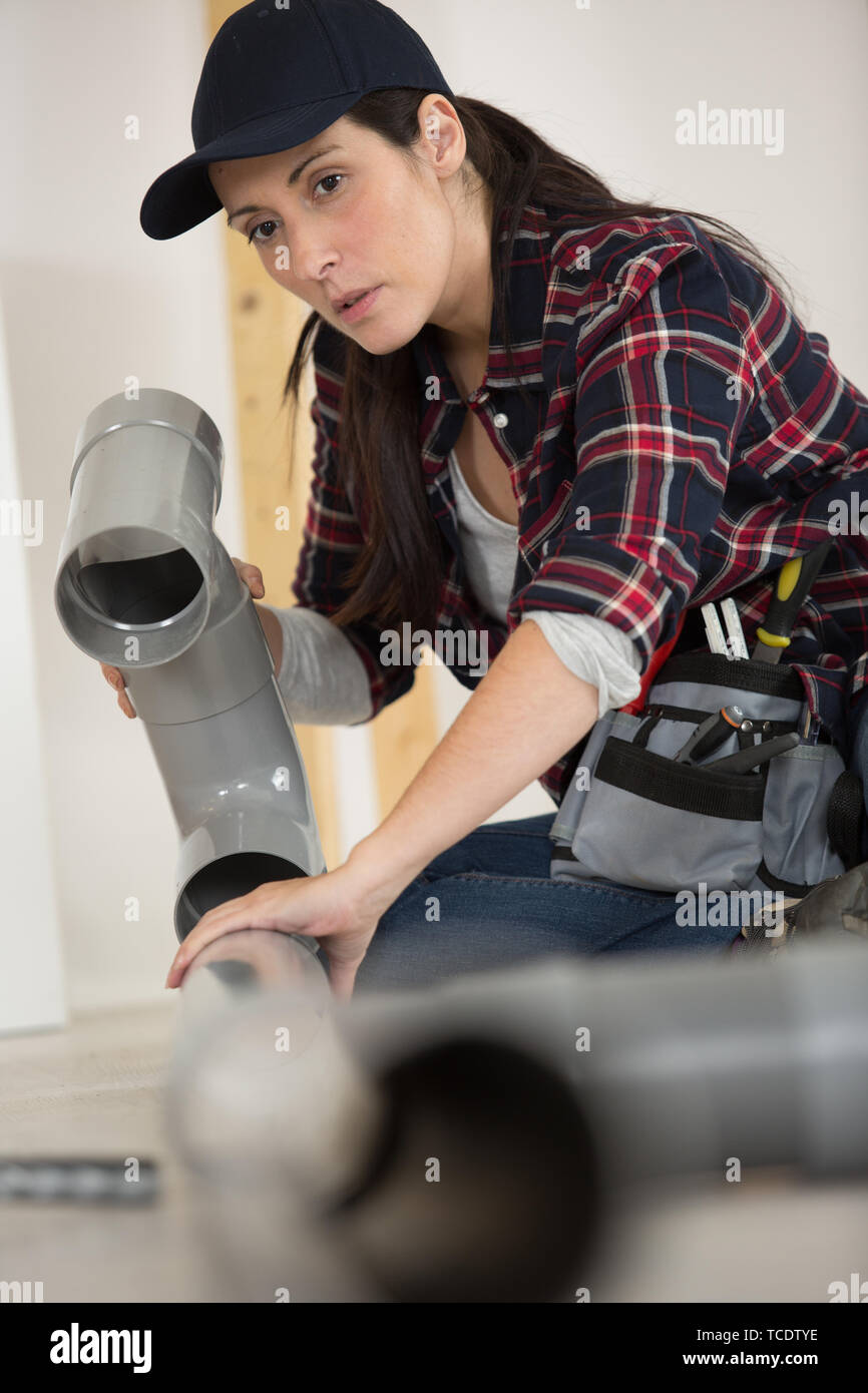 Construction worker carrying pipes hi-res stock photography and images - Alamy