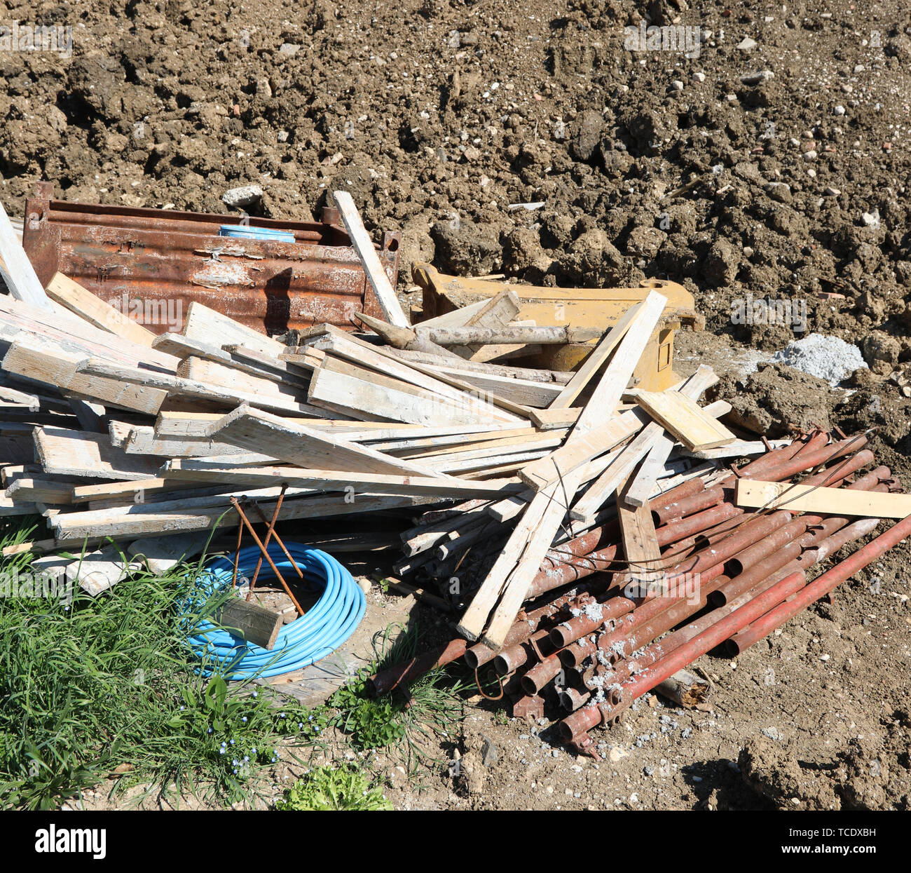 wooden boards and building material on the construction site during the ...