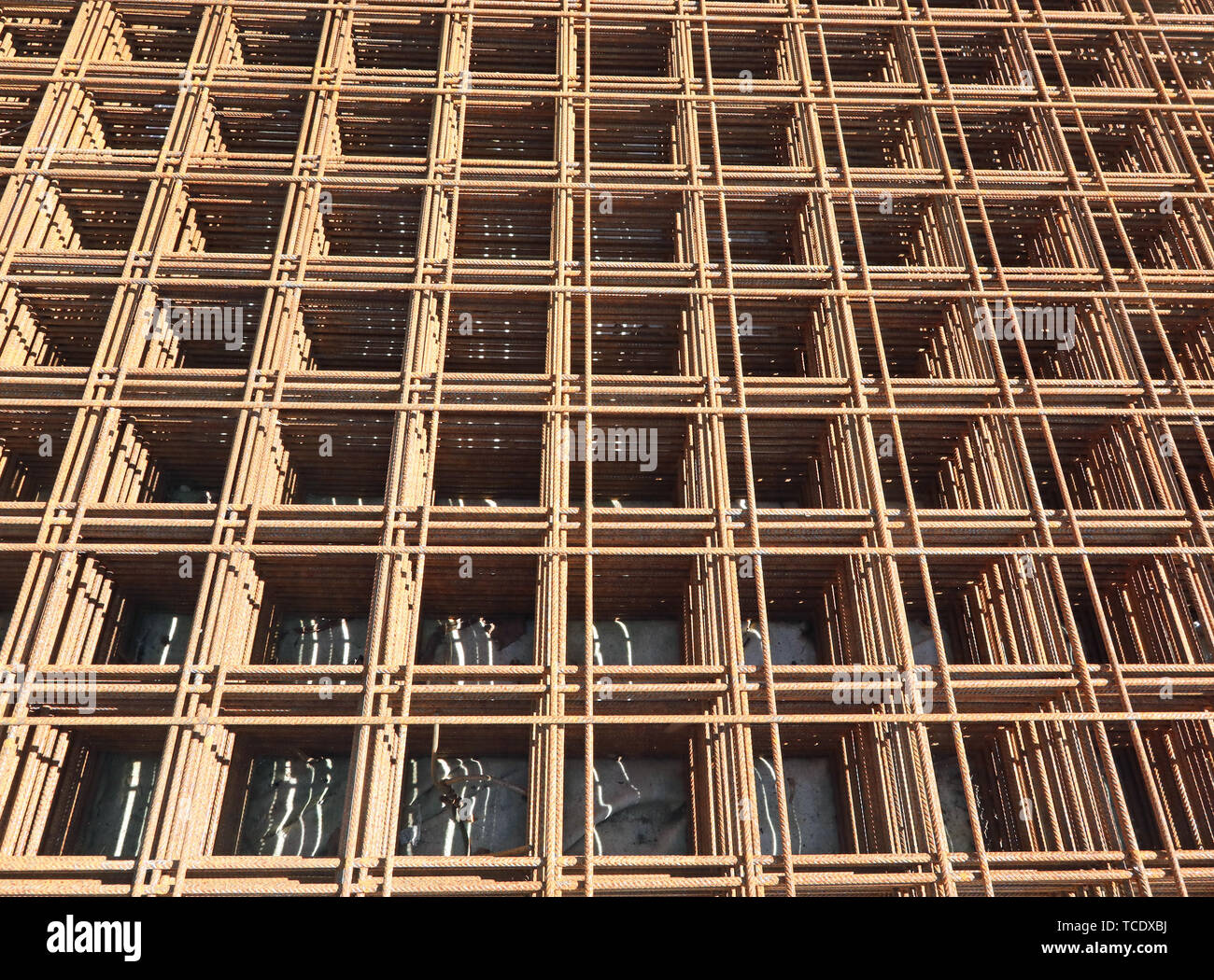 rusty electro-welded net on the building site to favor the pouring of ...