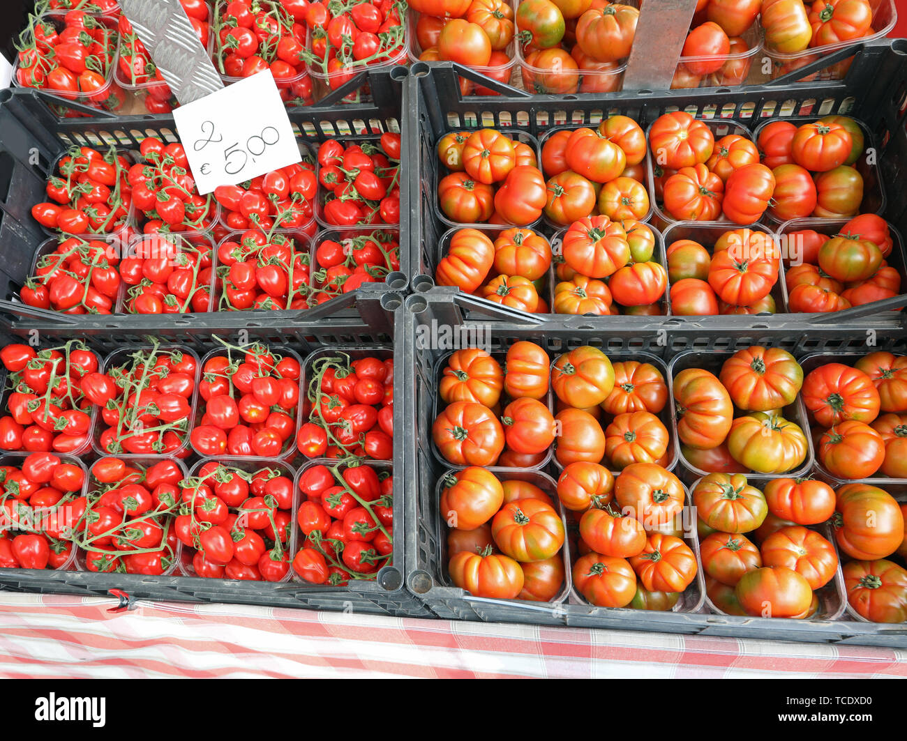 boxes of red tomatoes with tag price at greengrocer stand Stock Photo ...
