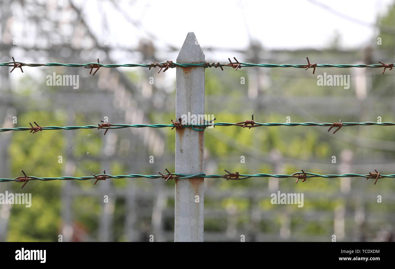 barbed wire in the restrict military area Stock Photo - Alamy