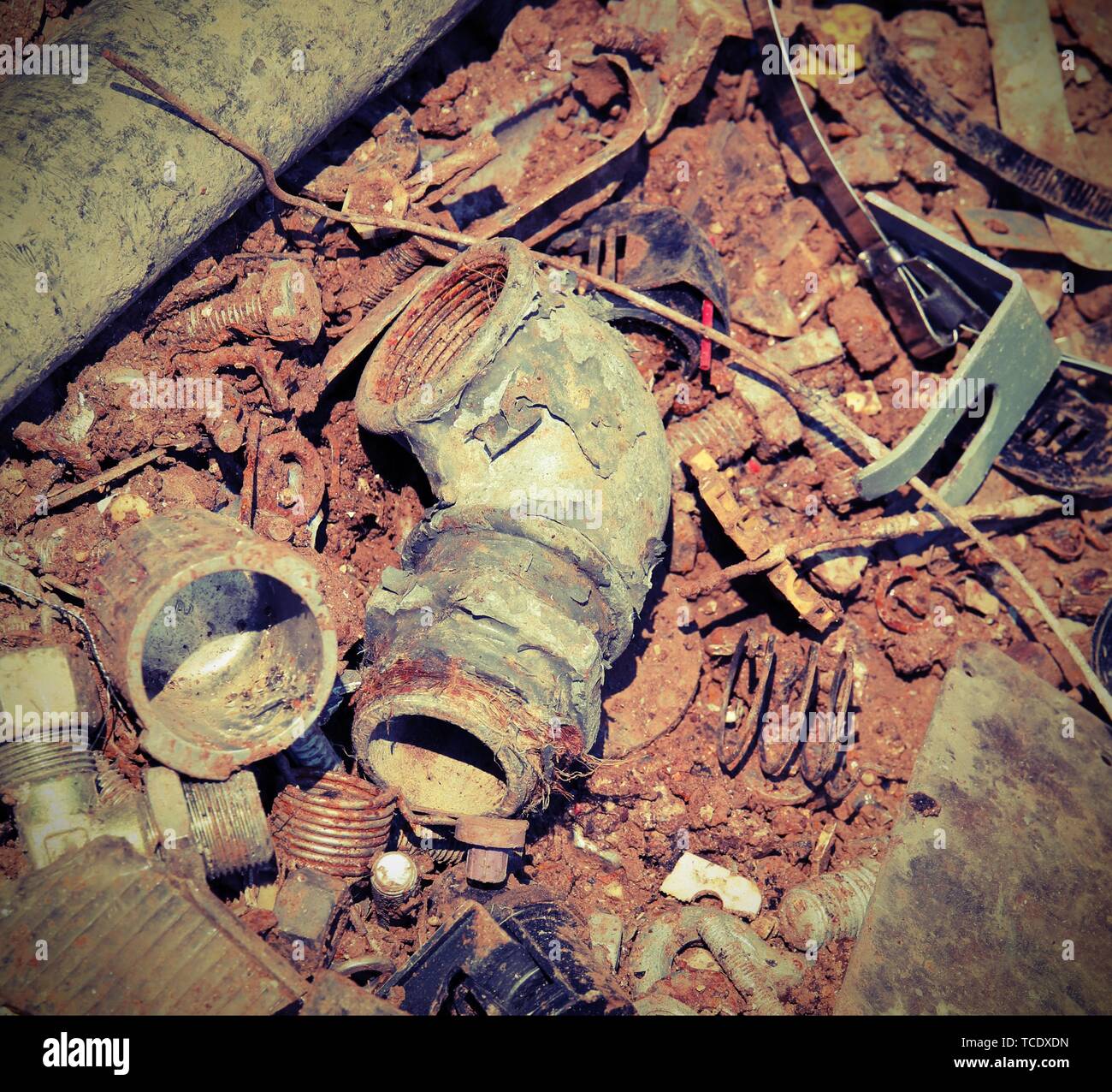 broken and used object with scraps metal at recycling center and toned ...