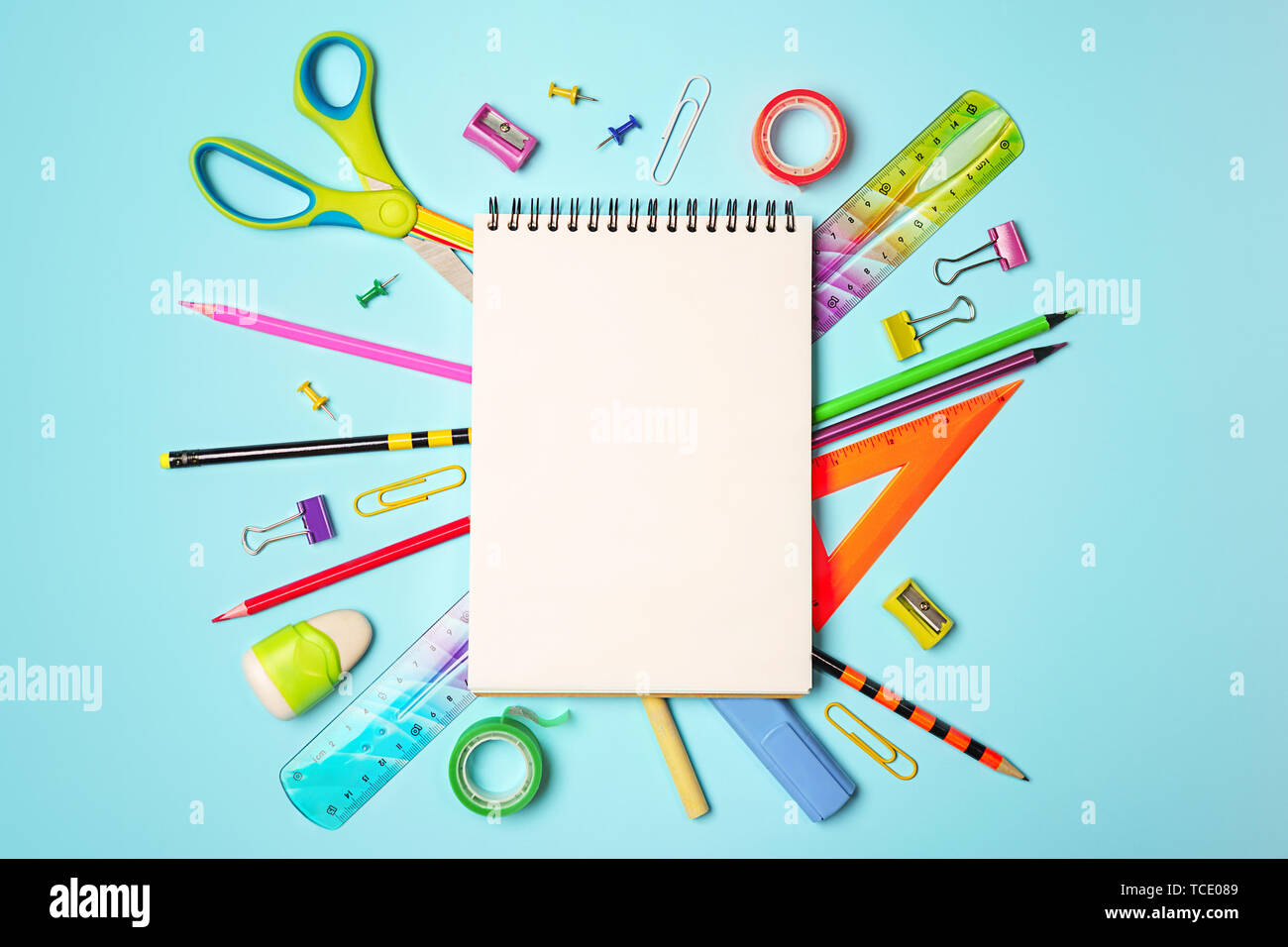 Back to school background with notepad, colorful pencils, square ruler ...