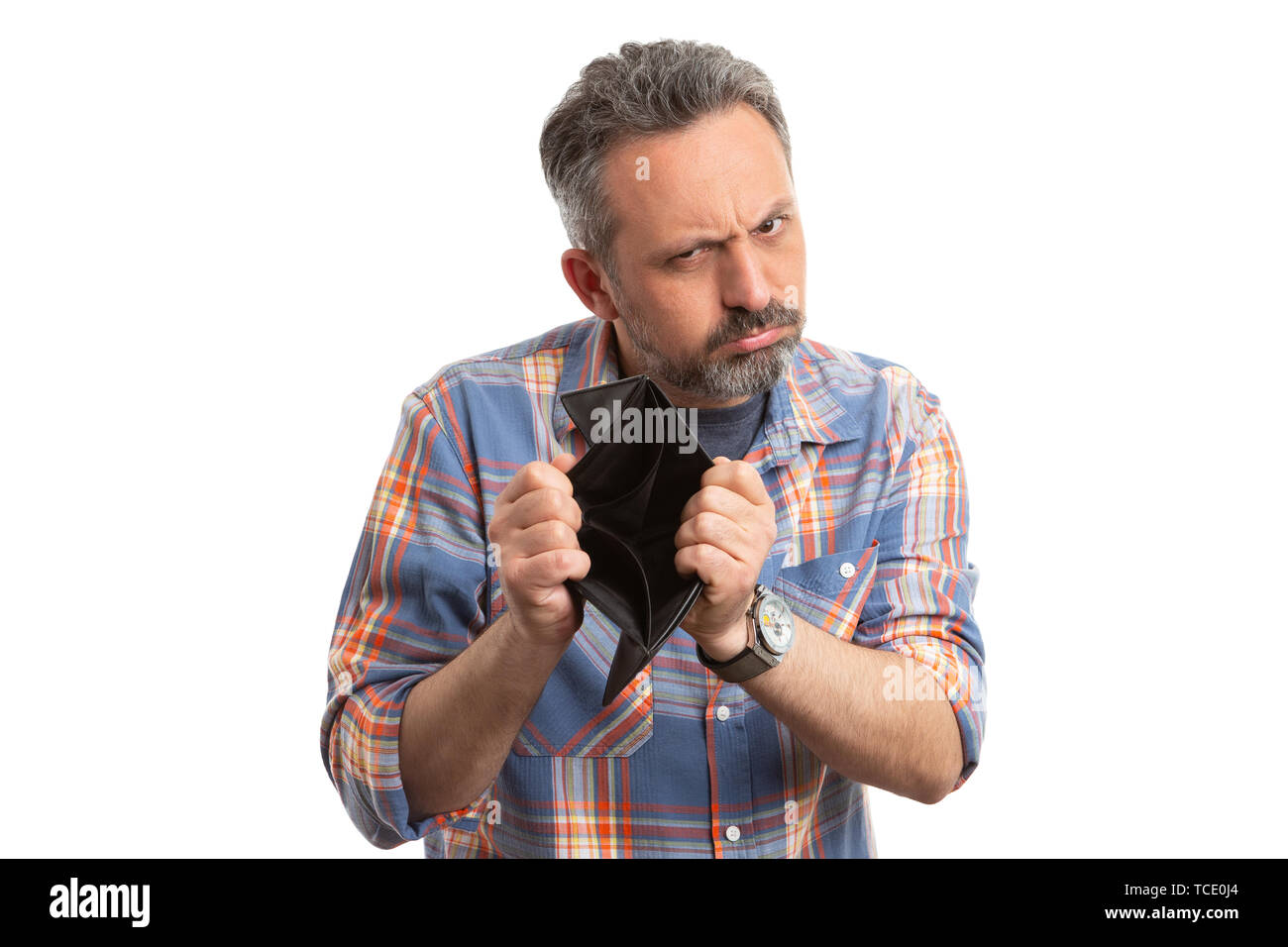 Man with sad or disappointed expression presenting empty brown leather ...