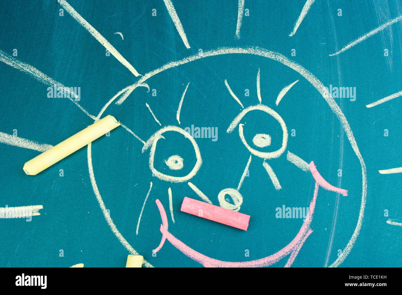 Sun, child's drawing with chalk Stock Photo - Alamy