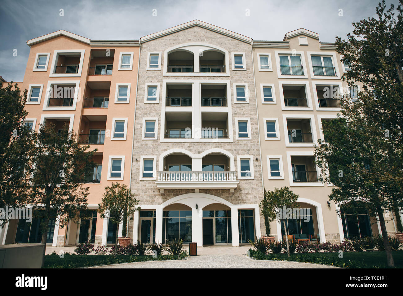 Front view of a modern apartment building or condominium or hotel ...