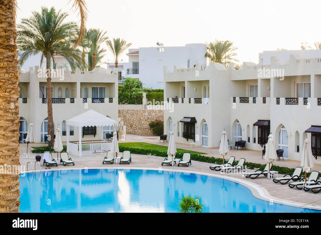 White houses and swimming pool on territory of five star hotel in Sharm ...