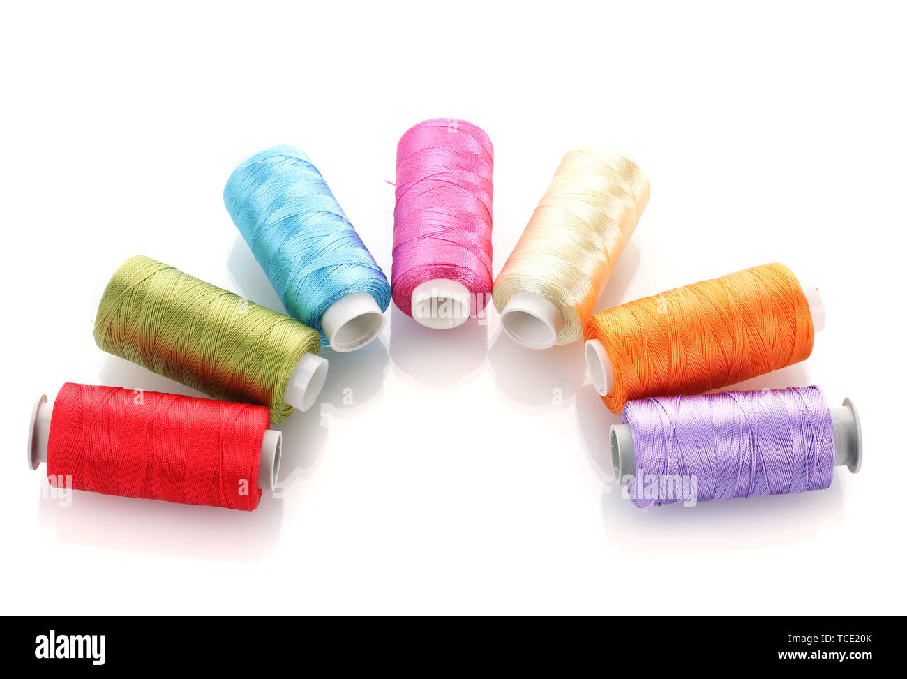 bright bobbin thread isolated on white Stock Photo - Alamy