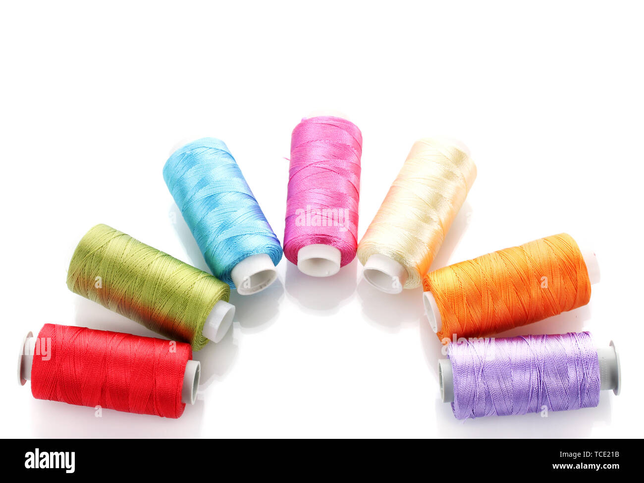 bright bobbin thread isolated on white Stock Photo - Alamy