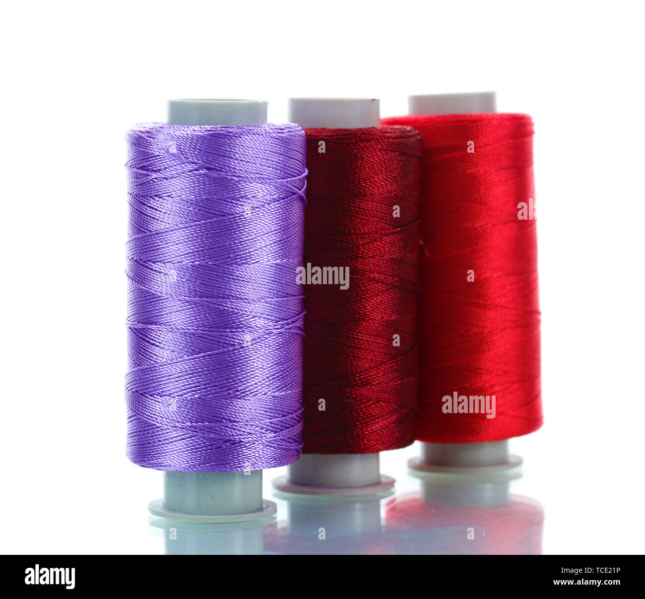 bright bobbin thread isolated on white Stock Photo - Alamy