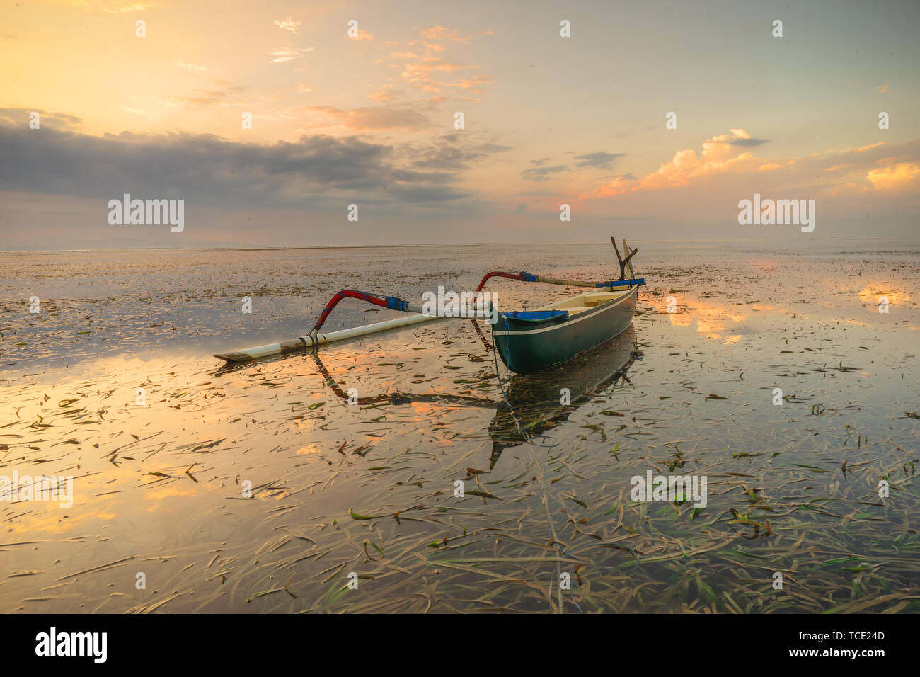 Traditional jukung boat anchored on beach, Sanur, Bali, Indonesia Stock ...