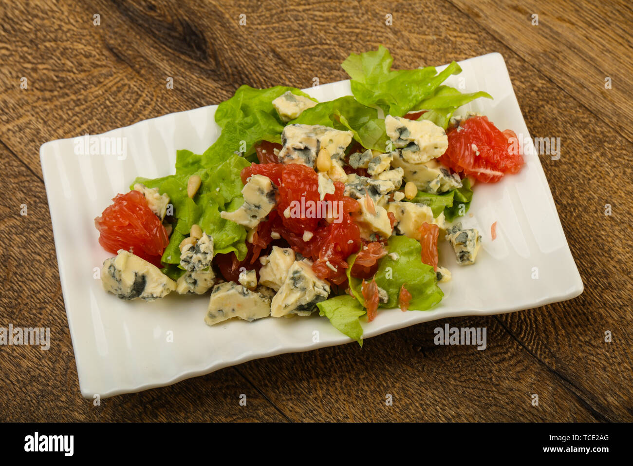 Grapefruit and blue cheese salad with cedar nut Stock Photo - Alamy