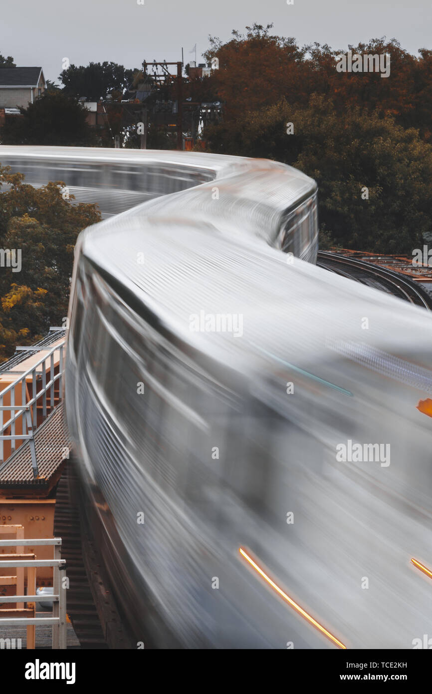 Train driving along elevated railway track, Chicago, Illinois, United ...