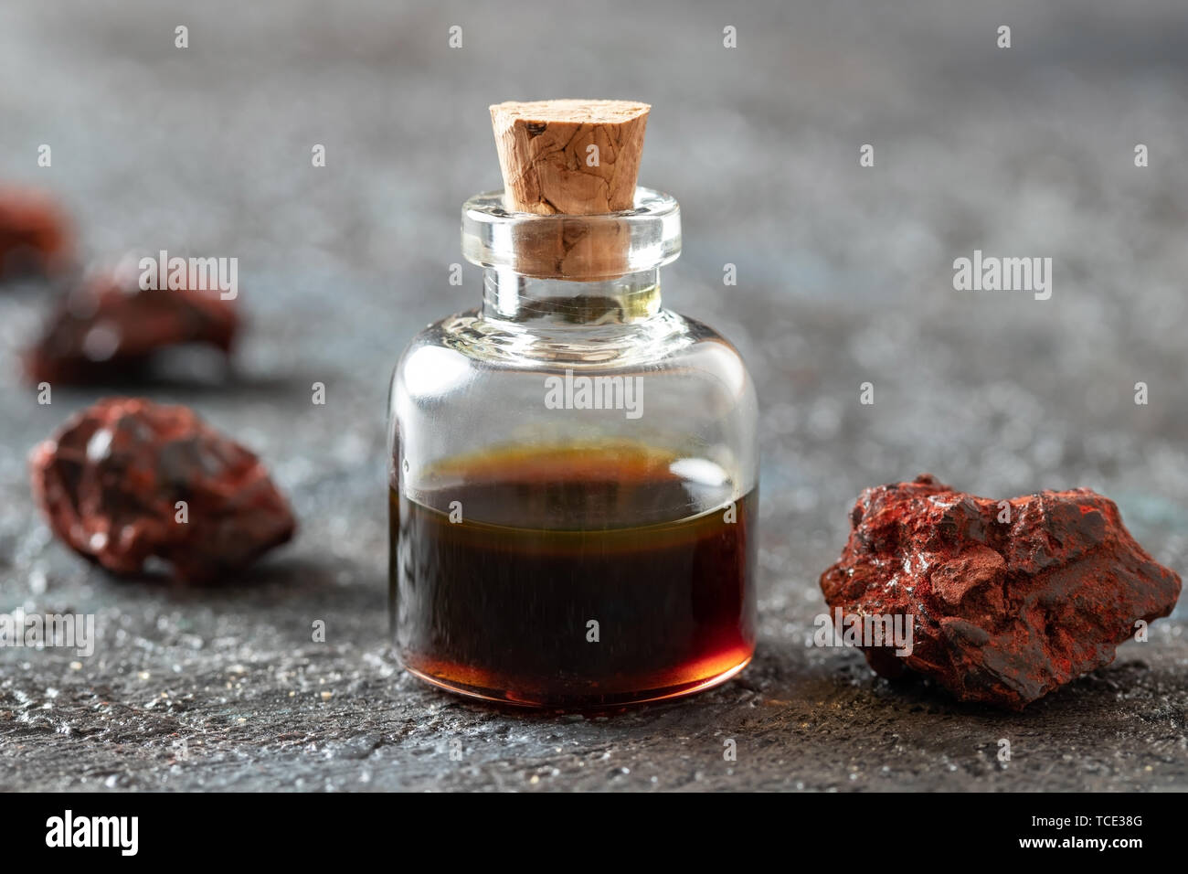 Croton lechleri, or sangre de drago oil and resin on a dark background ...