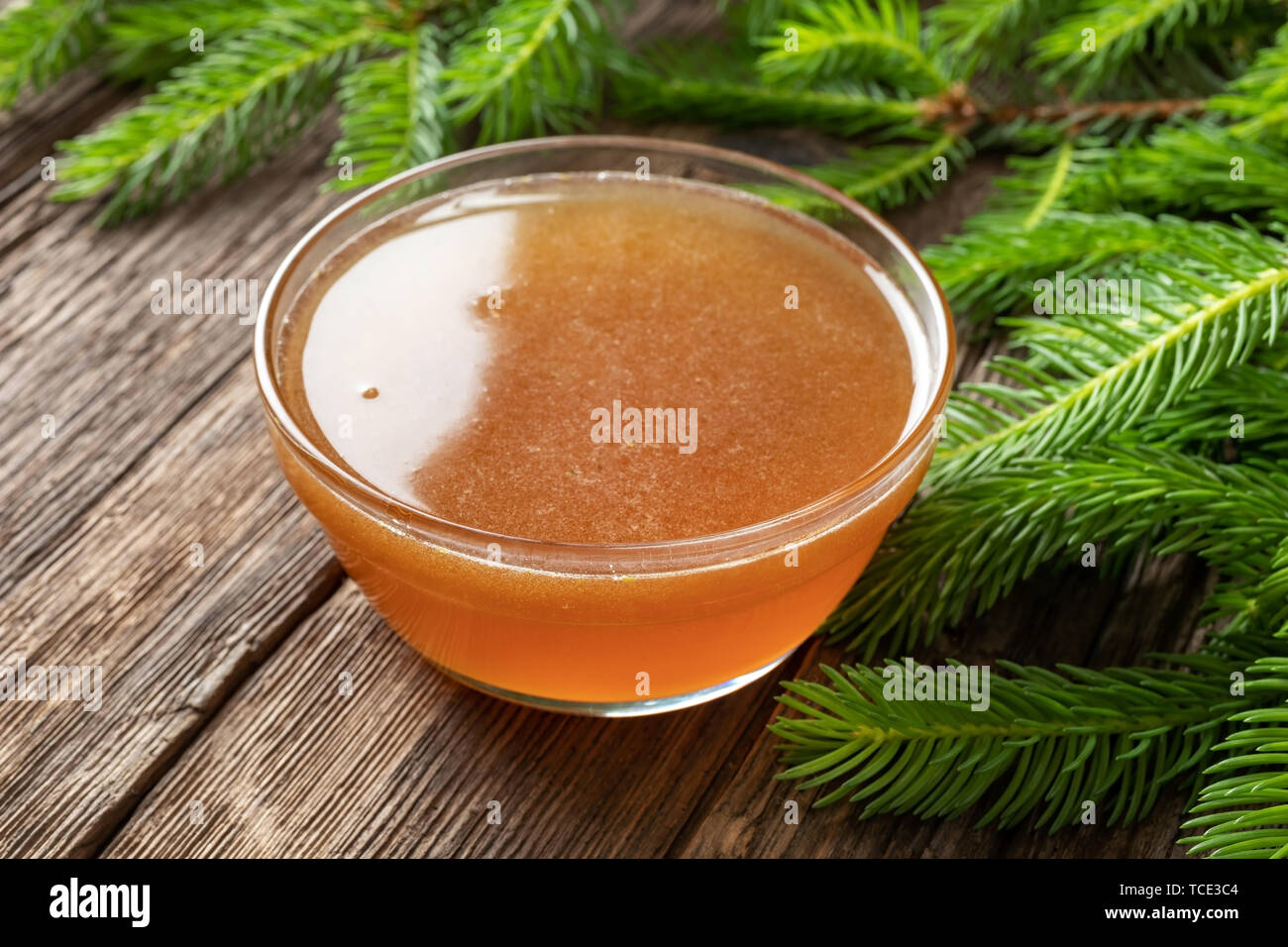 Homemade herbal syrup against cough made from young spruce tips in a ...
