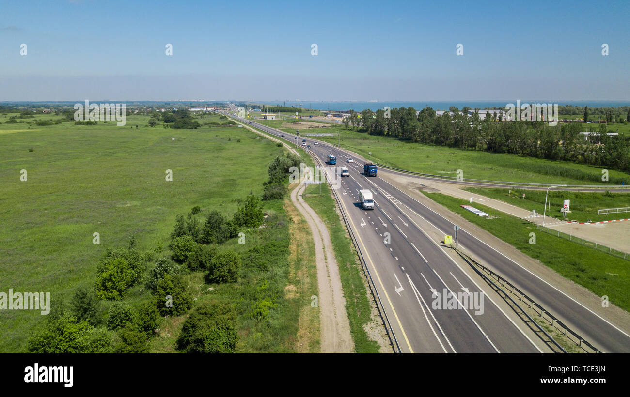 Aerial flying under highway traffic road with cars and truck Stock ...