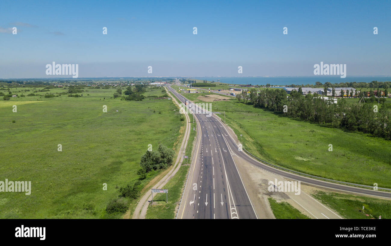 Aerial flying under highway traffic road with cars and truck Stock ...
