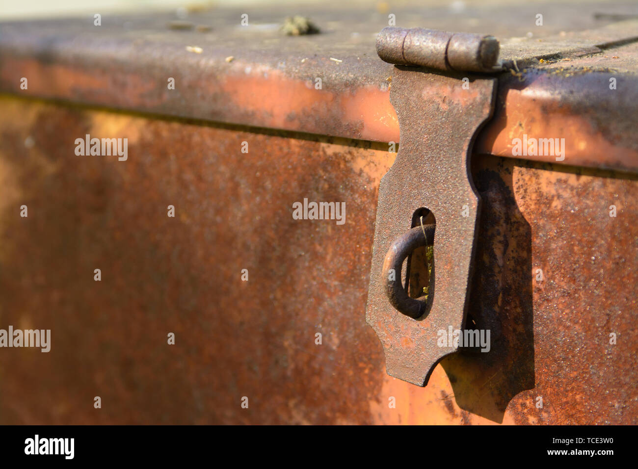 A rusted latch on an old metal chest Stock Photo - Alamy