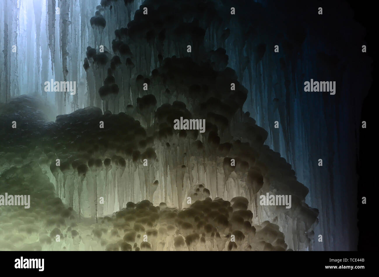 Huge ice icicles. Fragment of large blocks of ice frozen waterfall of ...