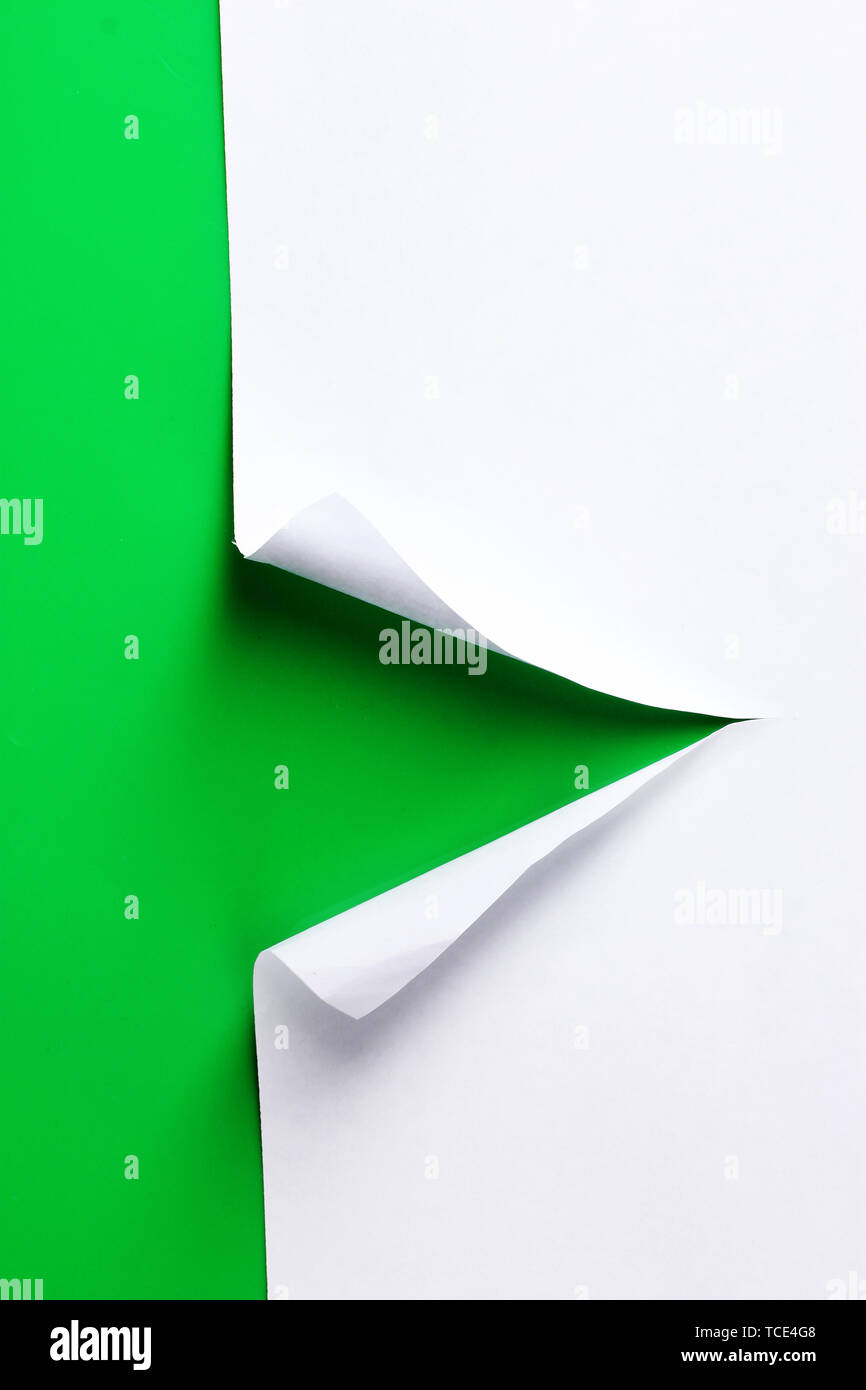 Torn paper with green background Stock Photo - Alamy