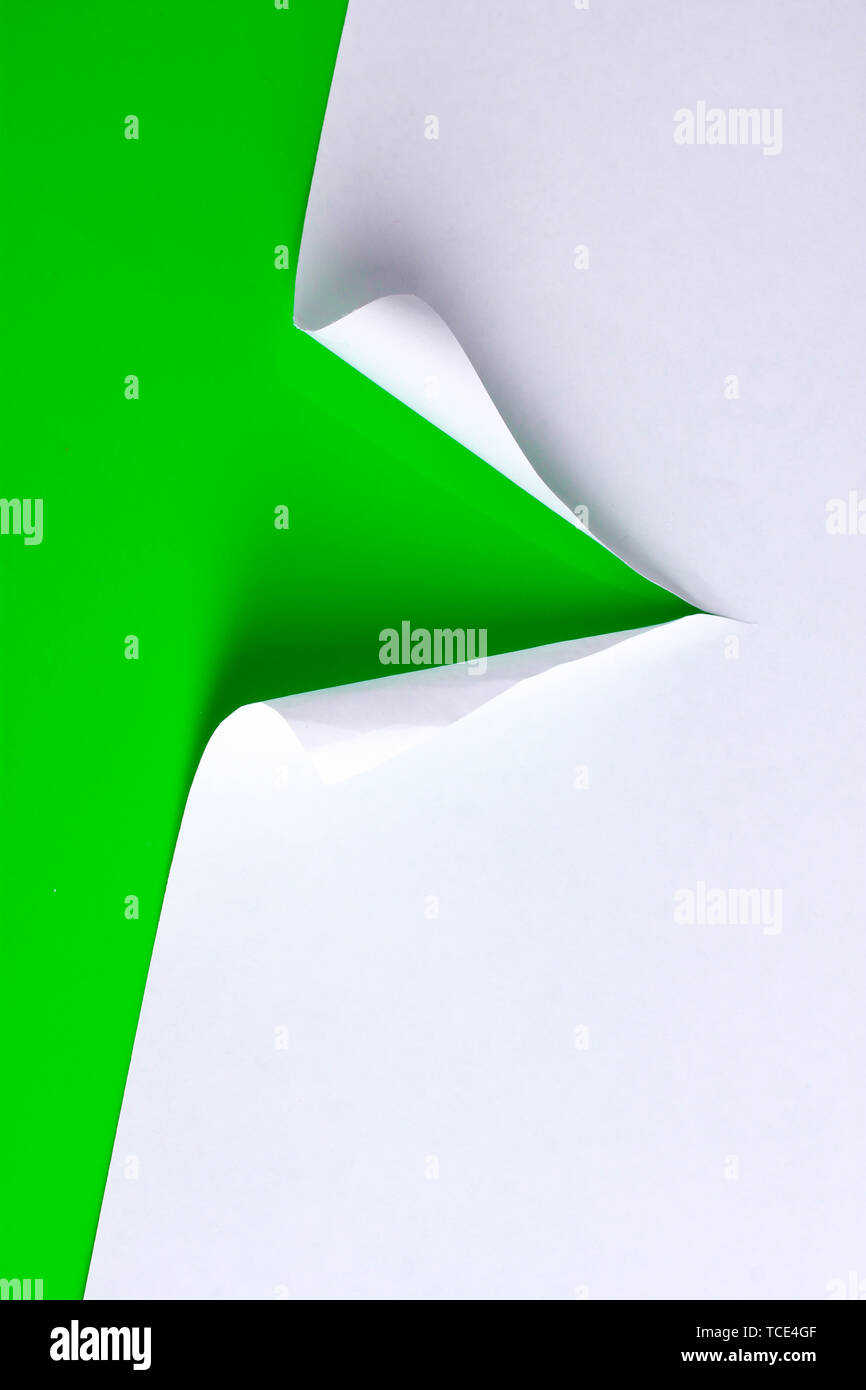 Torn paper with green background Stock Photo - Alamy