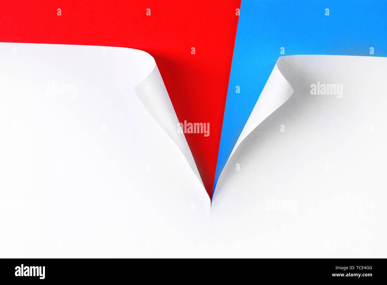 Torn paper with red and blue background Stock Photo - Alamy