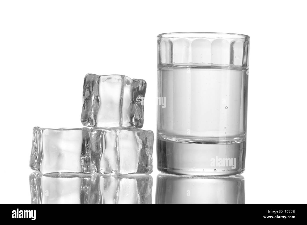 glass of vodka with ice isolaled on white Stock Photo - Alamy