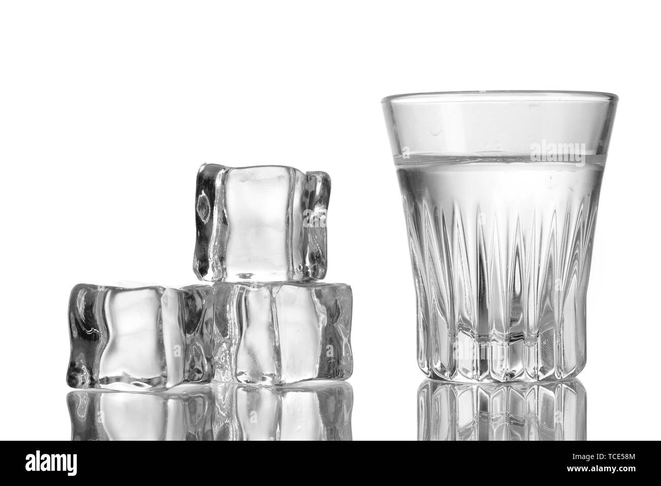 glass of vodka with ice isolaled on white Stock Photo - Alamy
