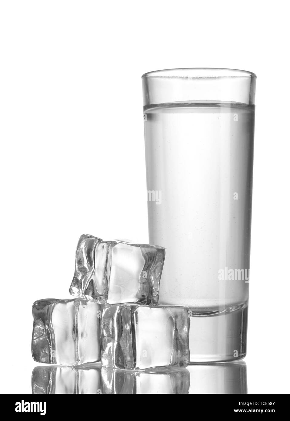 glass of vodka with ice isolaled on white Stock Photo - Alamy