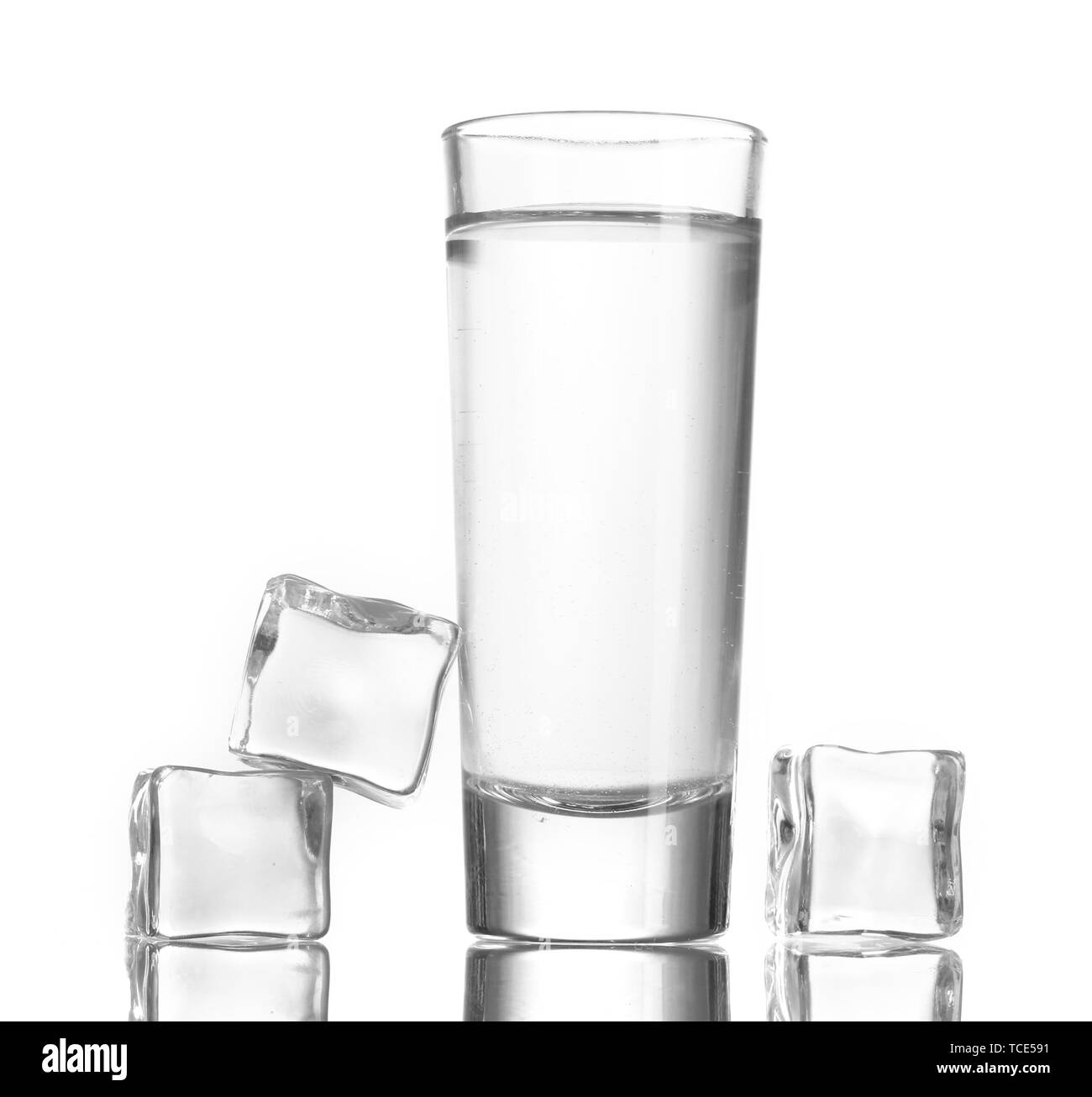 glass of vodka with ice isolaled on white Stock Photo - Alamy