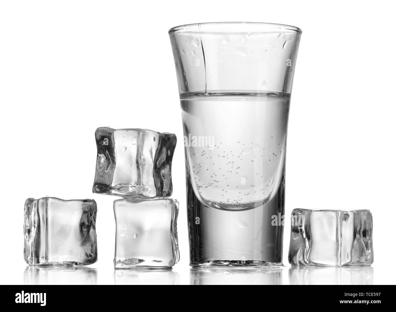glass of vodka with ice isolaled on white Stock Photo - Alamy