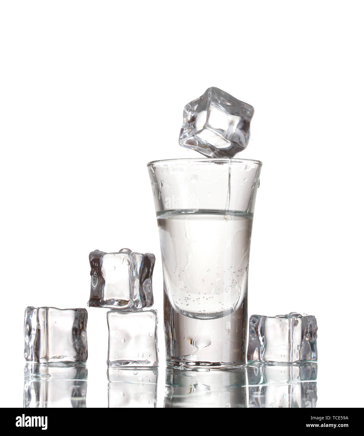 glass of vodka with ice isolaled on white Stock Photo - Alamy