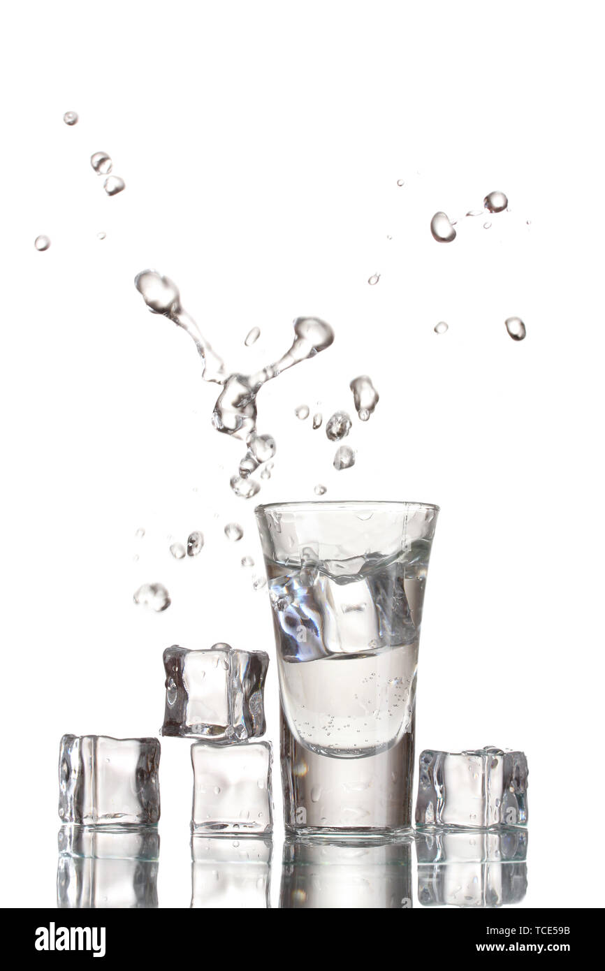 glass vodka and ice isolated on white Stock Photo - Alamy