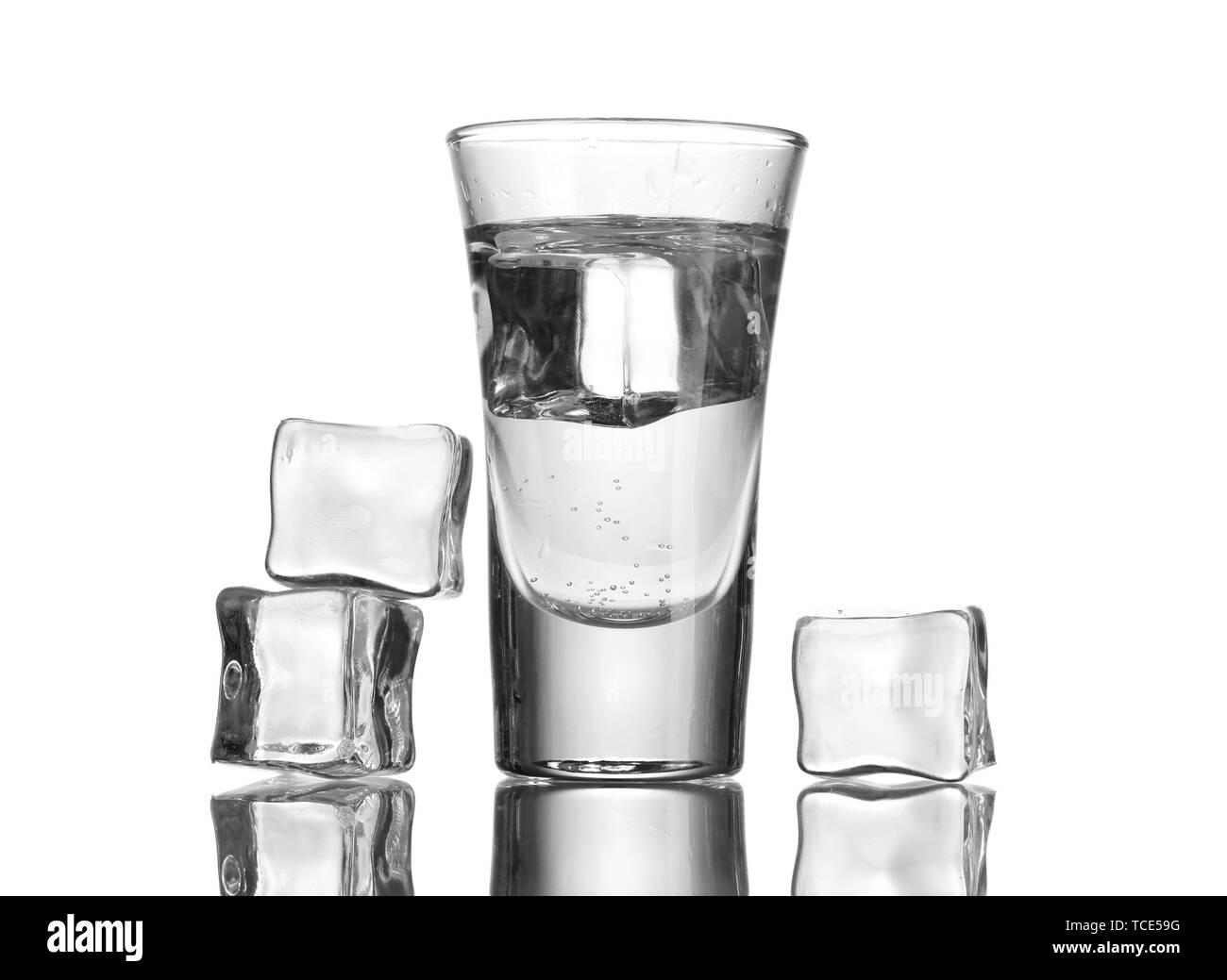 glass of vodka with ice isolaled on white Stock Photo - Alamy
