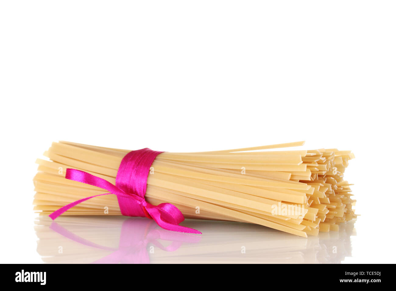 Bunch of spaghetti with ribbon isolated on white Stock Photo - Alamy
