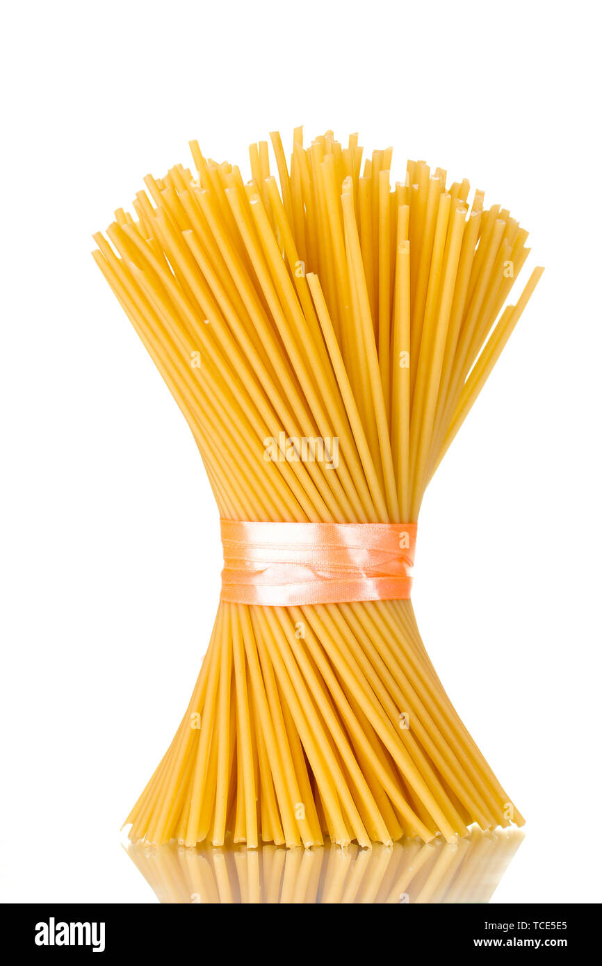 Bunch of spaghetti with ribbon isolated on white Stock Photo - Alamy