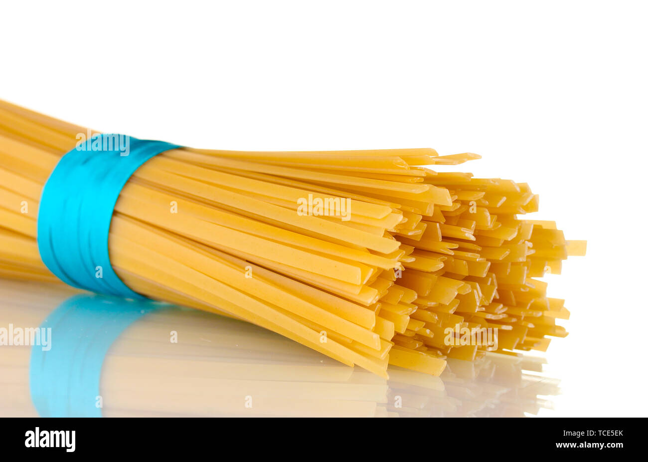 Bunch of spaghetti with ribbon isolated on white Stock Photo - Alamy