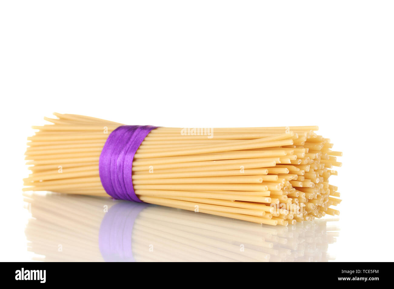 Bunch of spaghetti with ribbon isolated on white Stock Photo - Alamy