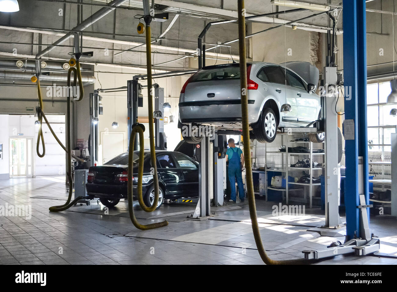 Car on hoist at repair shop automobile hi-res stock photography and ...