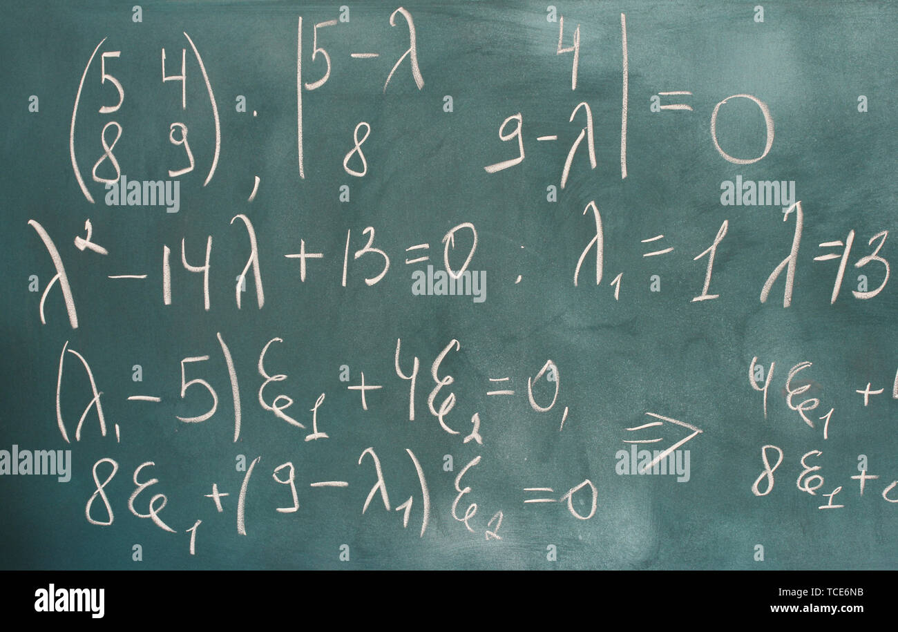formulas written on green chalkboard Stock Photo - Alamy