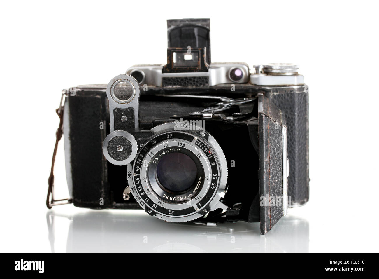 Old photo camera isolated on white Stock Photo - Alamy