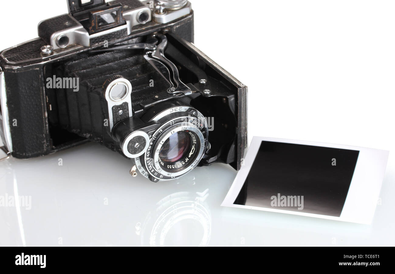 Old photo camera with photo paper isolated on white Stock Photo - Alamy
