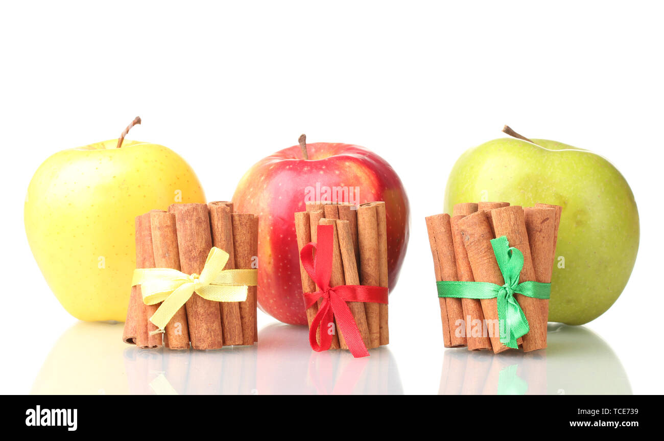 Cinnamon sticks and apples isolated on white Stock Photo - Alamy