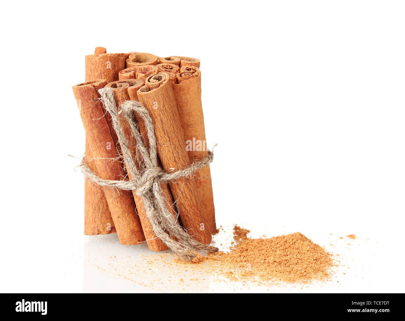 Cinnamon sticks and powder isolated on white Stock Photo - Alamy