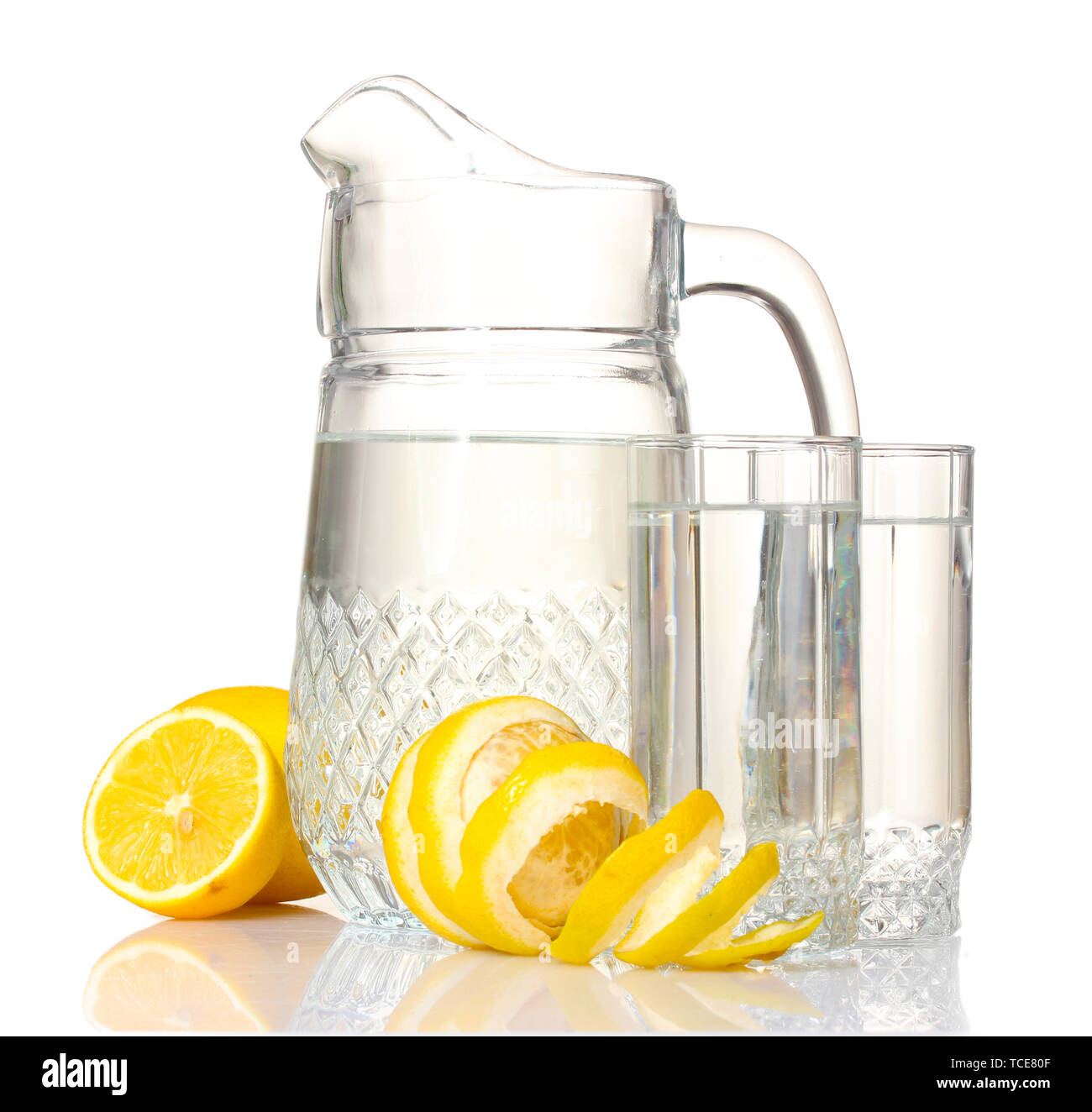 pitcher and glasses of lemonade and lemon isolated on white Stock Photo ...