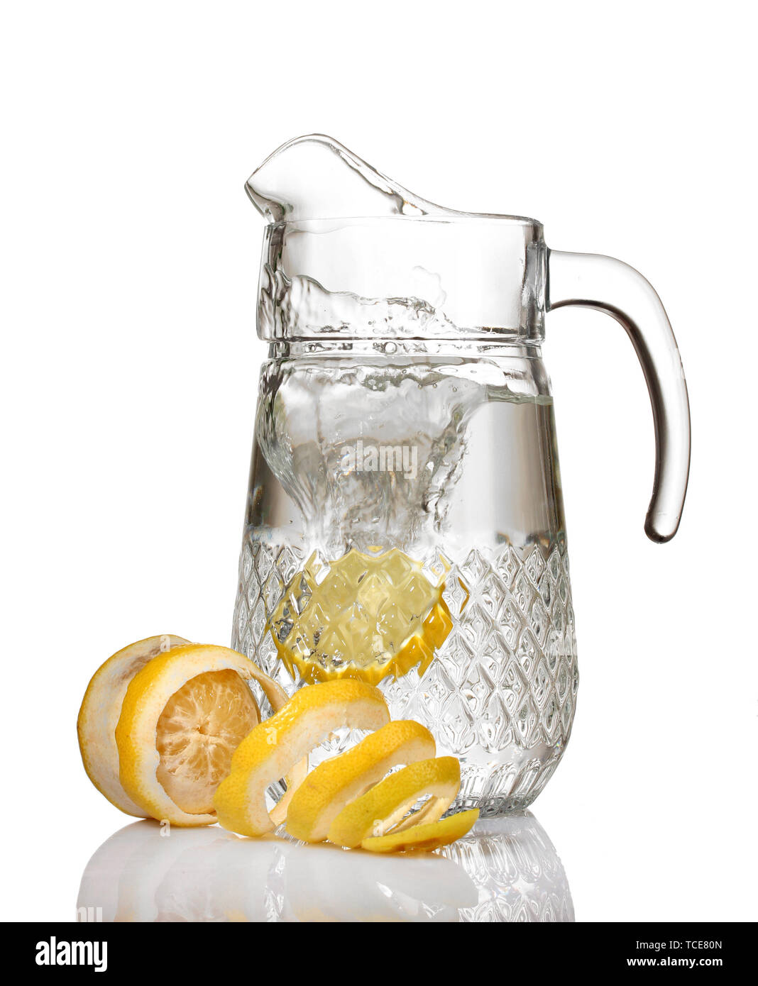 pitcher of lemonade and lemon isolated on white Stock Photo - Alamy