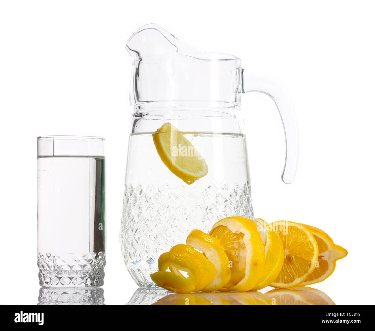 pitcher and glasses of lemonade and lemon isolated on white Stock Photo ...